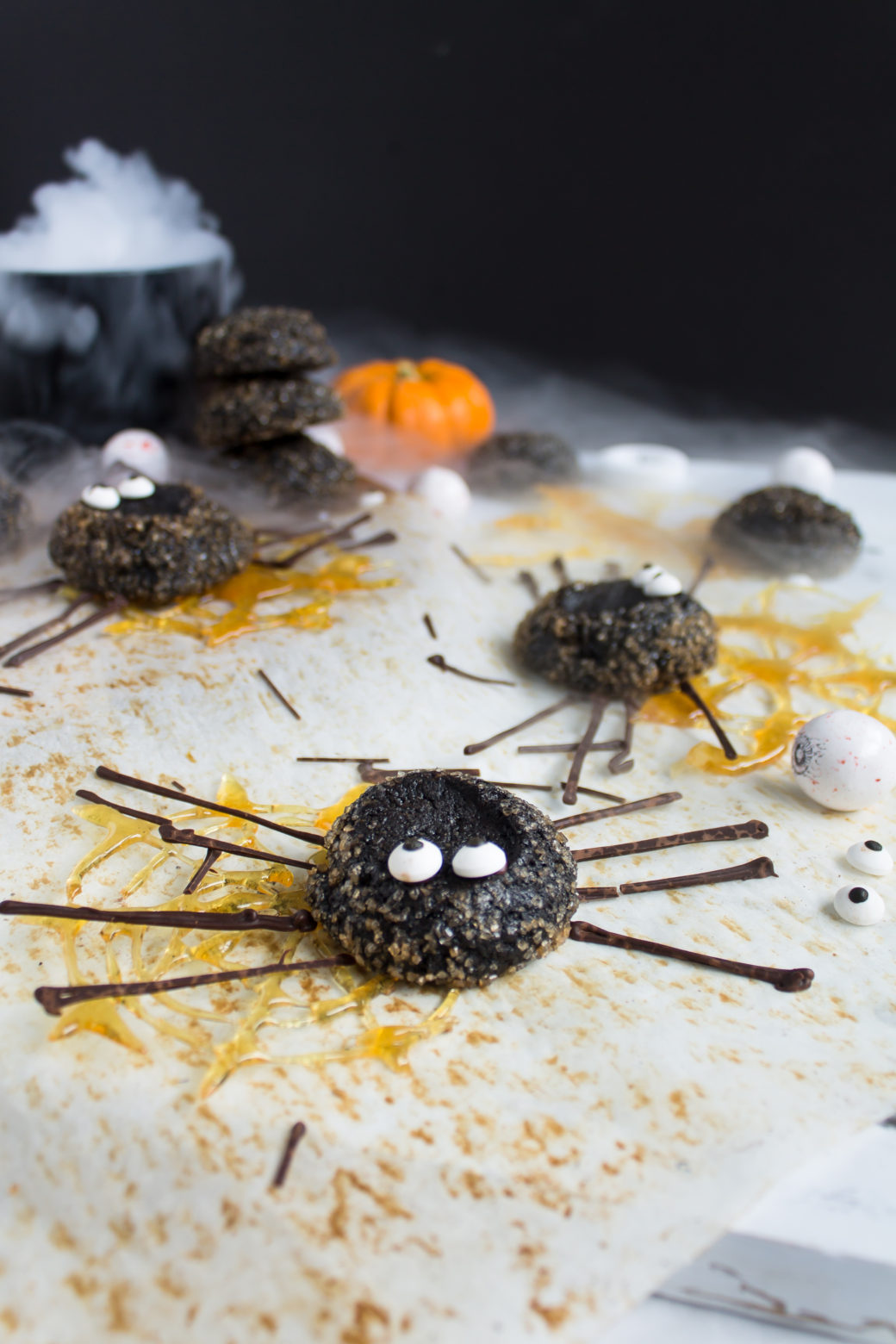 chocolate thumbprint cookie spiders with caramel spider webs - Pass the ...