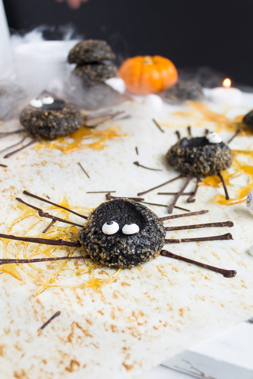 chocolate thumbprint cookie spiders with caramel spider webs - Pass the ...